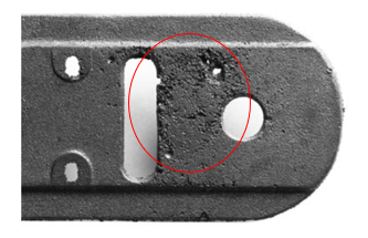 a.Sand inclusion defect in component